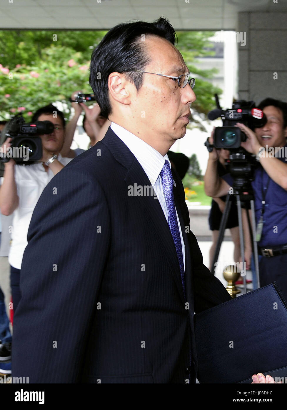 Kenji Kanasugi, minister at the Japanese Embassy in Seoul, enters the ...