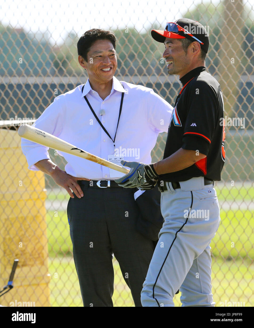 Former major league outfielder So Taguchi (L) chats with Ichiro Suzuki ...