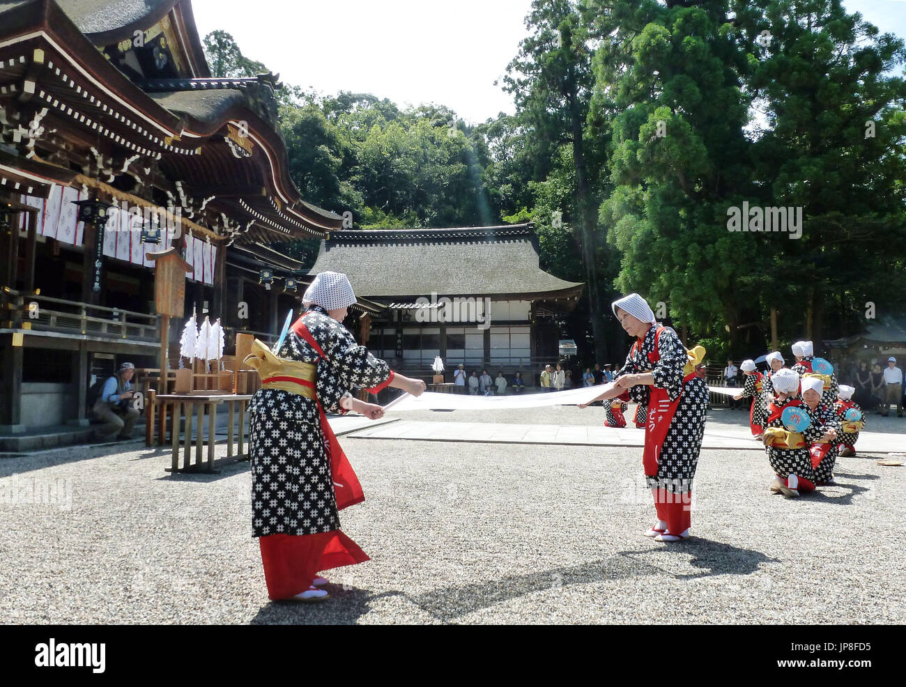 Women perform "Somen Kakeuta," a song and dance depicting the process ...