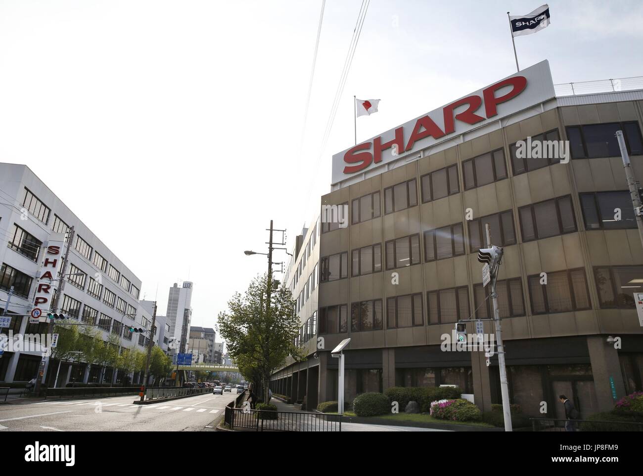 One of Sharp Corp.'s building (R) housing its headquarters functions in ...
