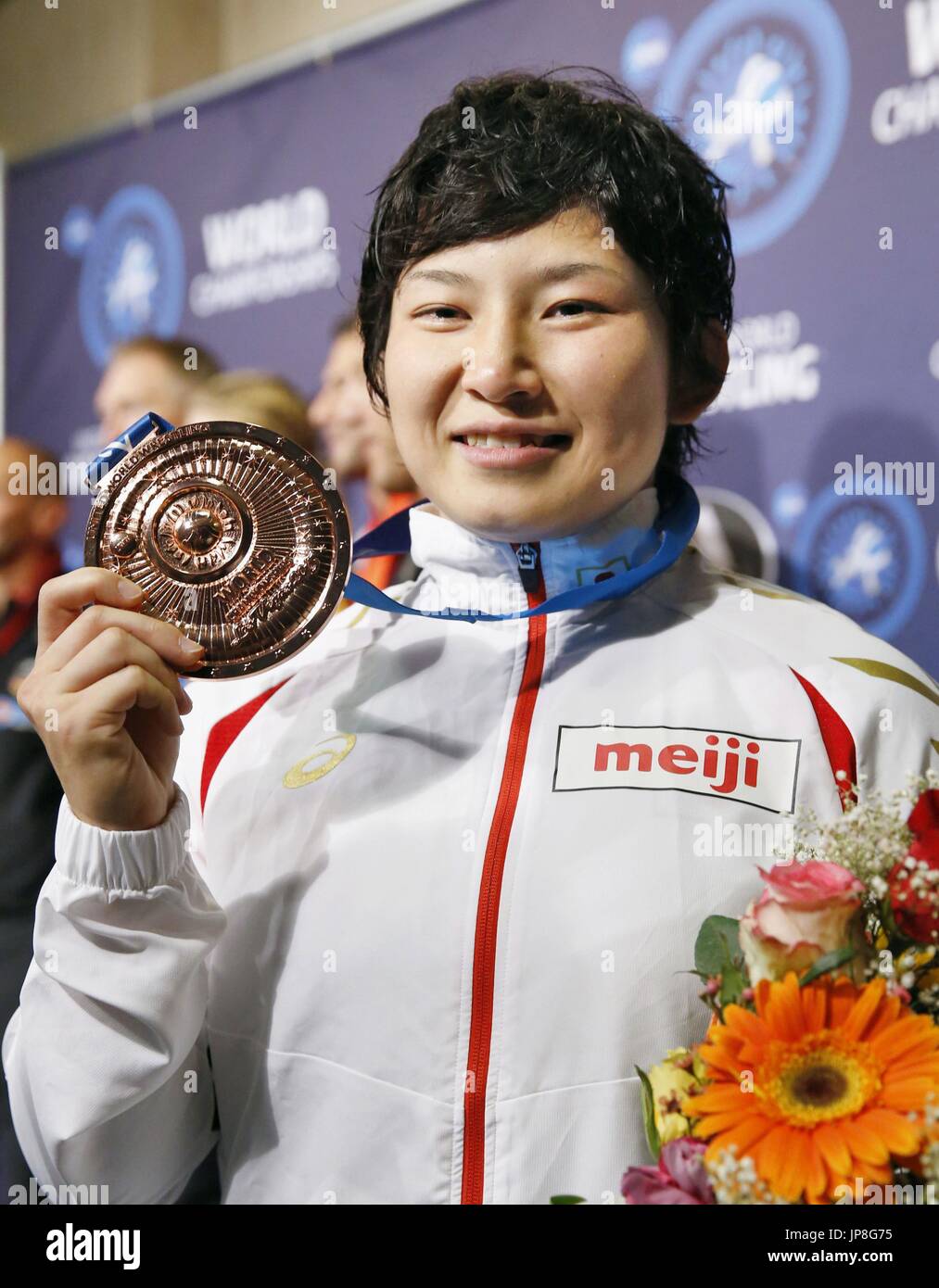 Sara Dosho holds her bronze medal in the women's 69-kg division award ...
