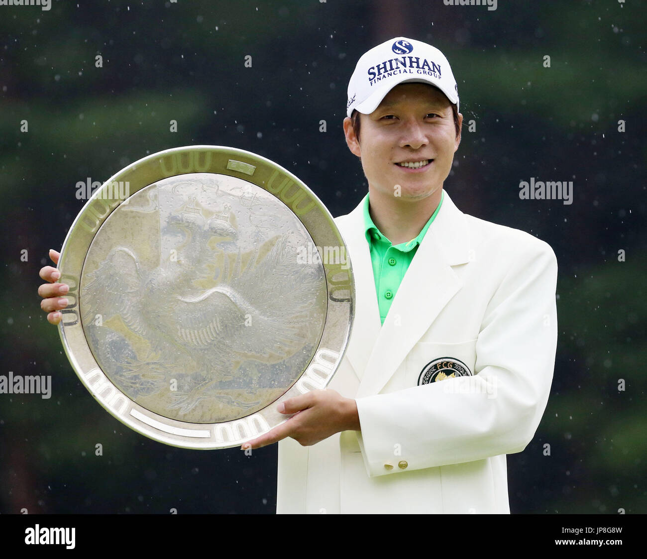 Kim Kyung Tae of South Korea poses with a trophy after winning the ...