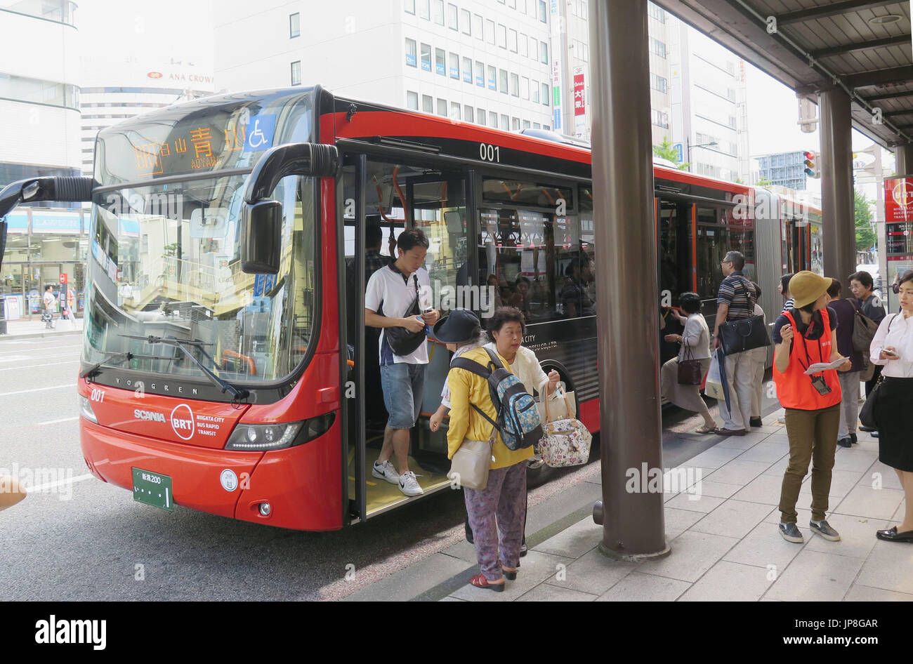 People use the Bus Rapid Transit system in Niigata on Sept. 5, 2015 ...