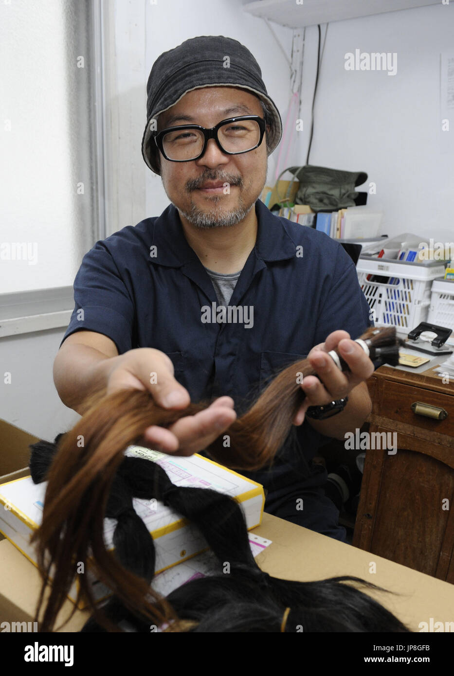 Kiichi Watanabe, pictured in Osaka on Aug. 29, 2015, makes and donates ...