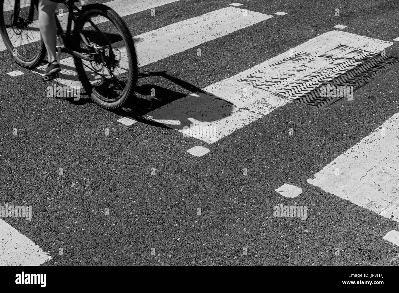 Black and white of the bike crossing on the zebra road Stock Photo - Alamy