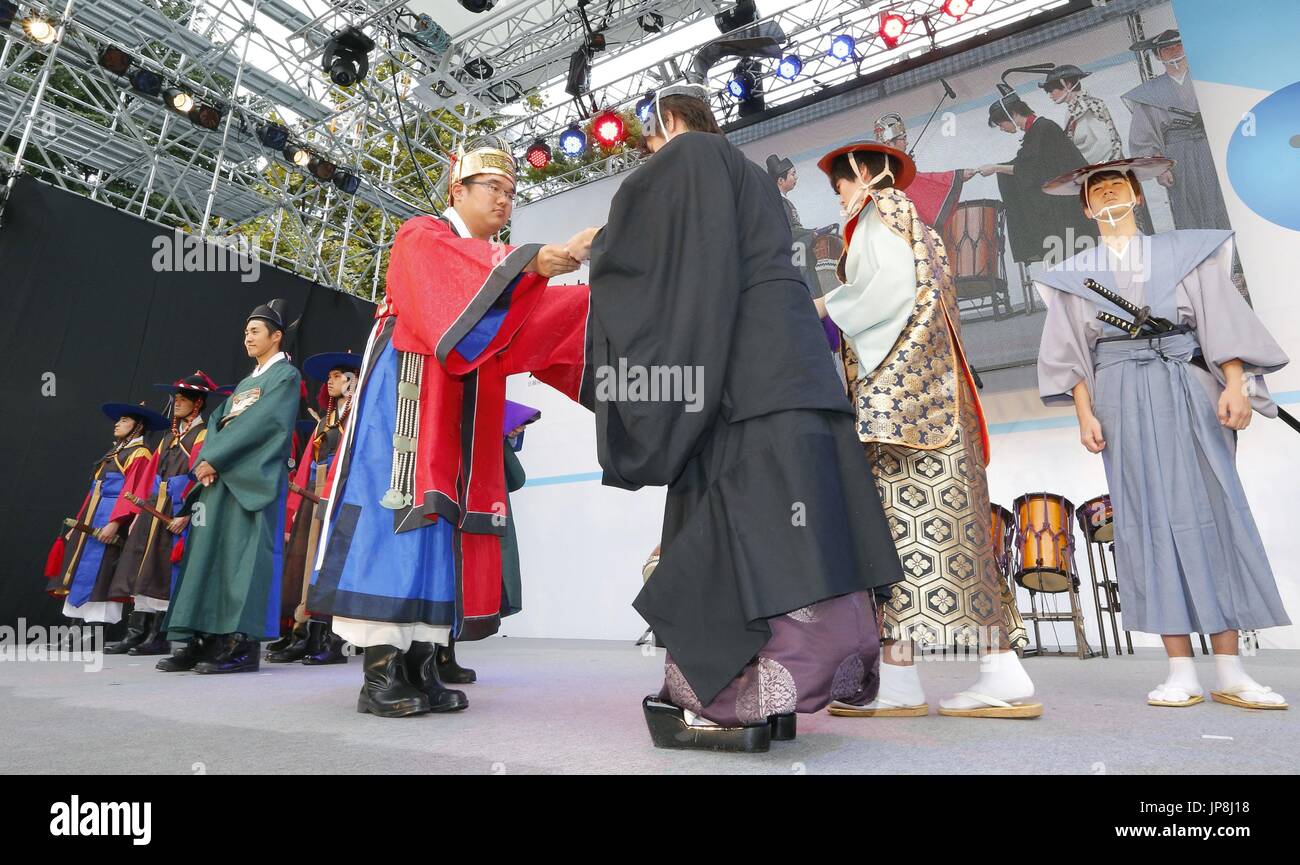Japanese and South Korean students wearing costumes of representatives ...