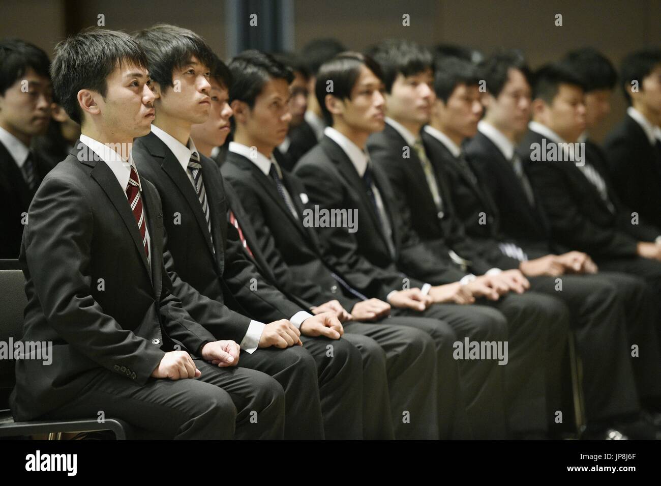 Students graduating in March 2016 attend a ceremony to formally receive ...