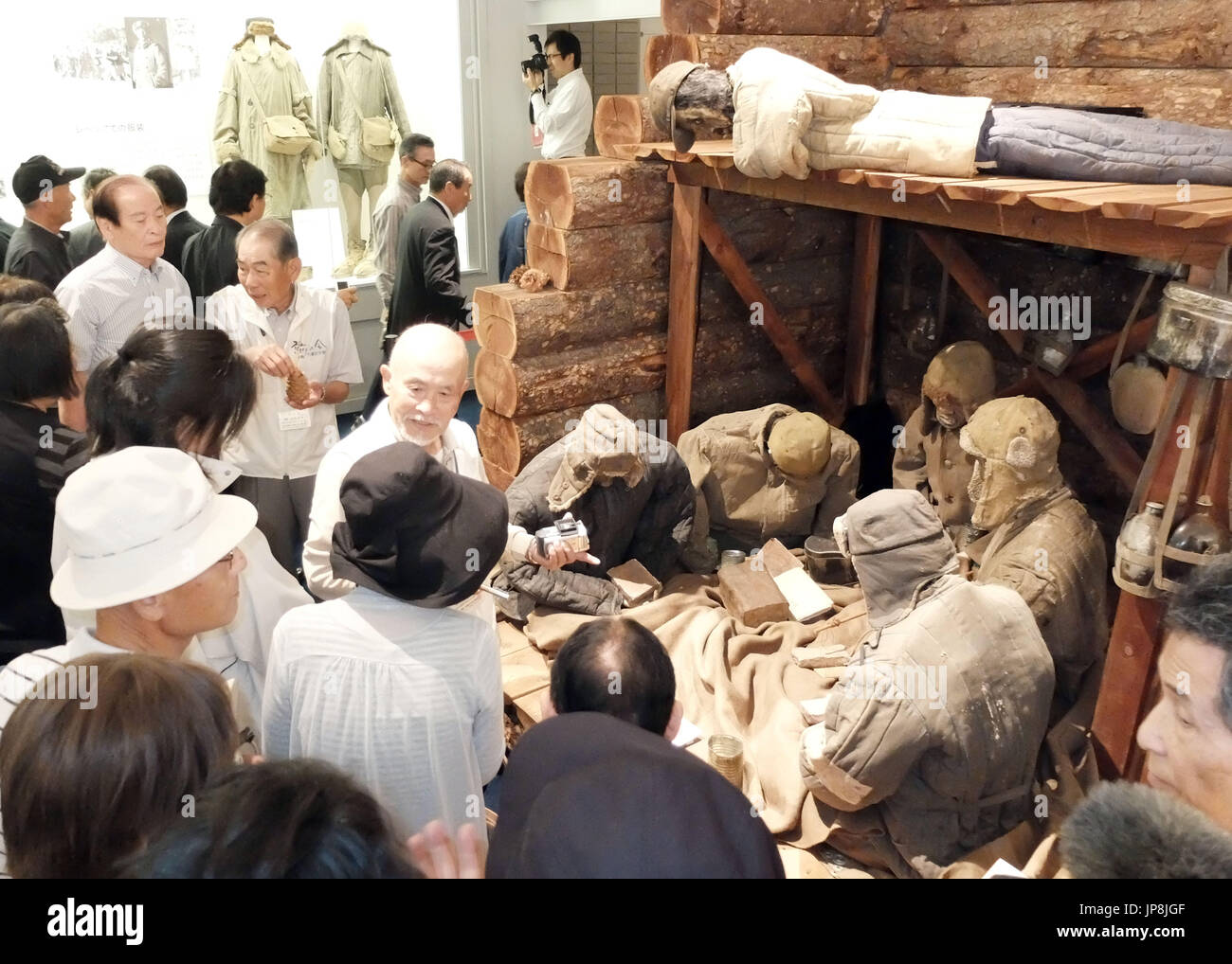 Visitors look at renewed exhibits at the Maizuru Repatriation Memorial ...
