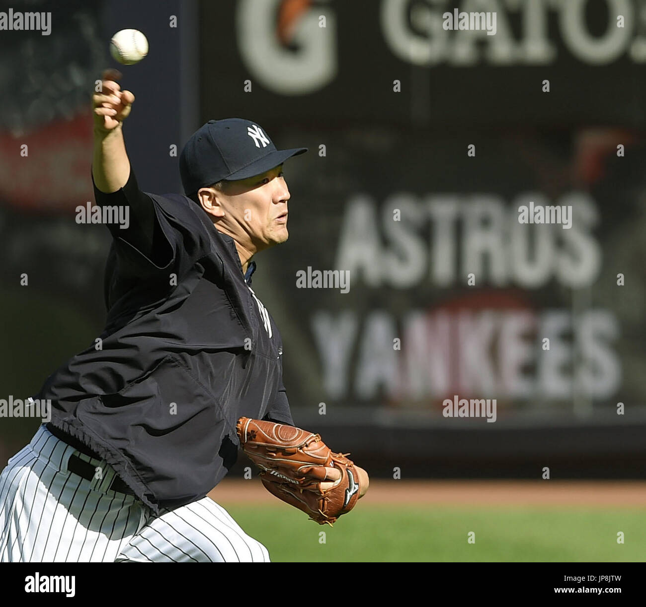 New York Yankees pitcher Masahiro Tanaka throws the ball during a workout at Yankee Stadium in ...