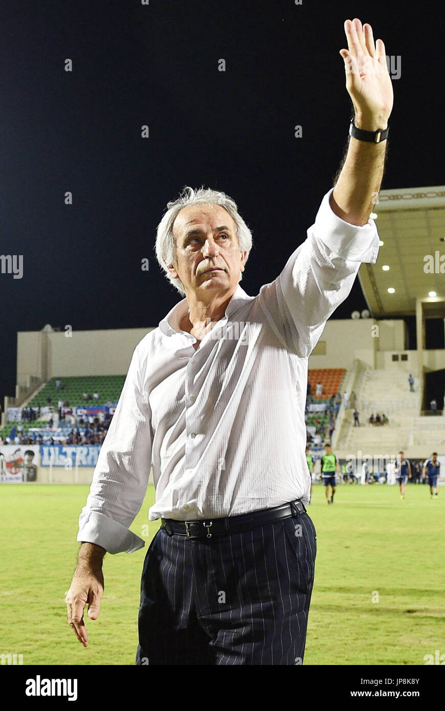 Japan coach Vahid Halilhodzic waves to supporters as his team beat ...
