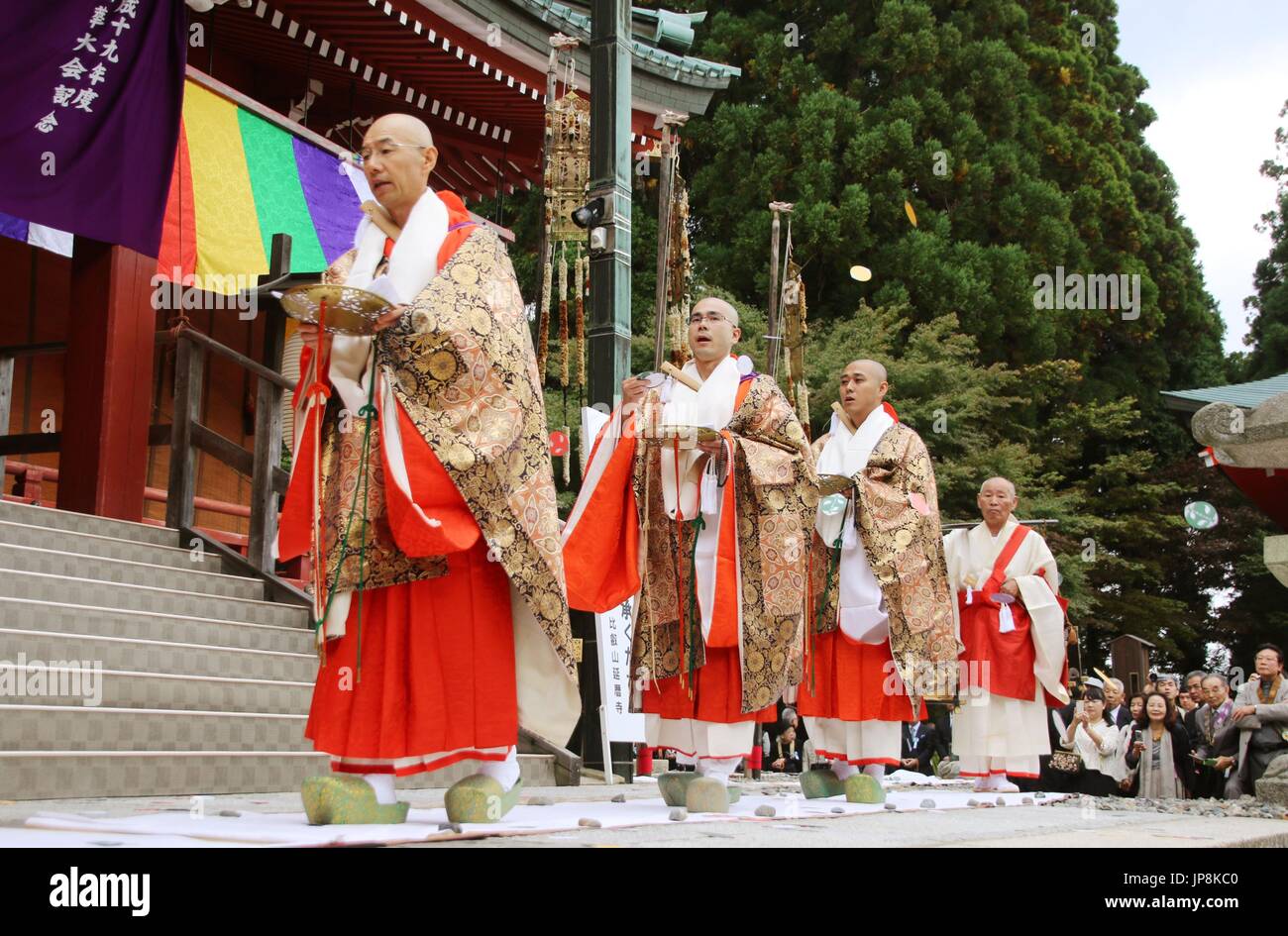 Tendai Buddhism priests walk around the "Daikodo" auditorium chanting ...