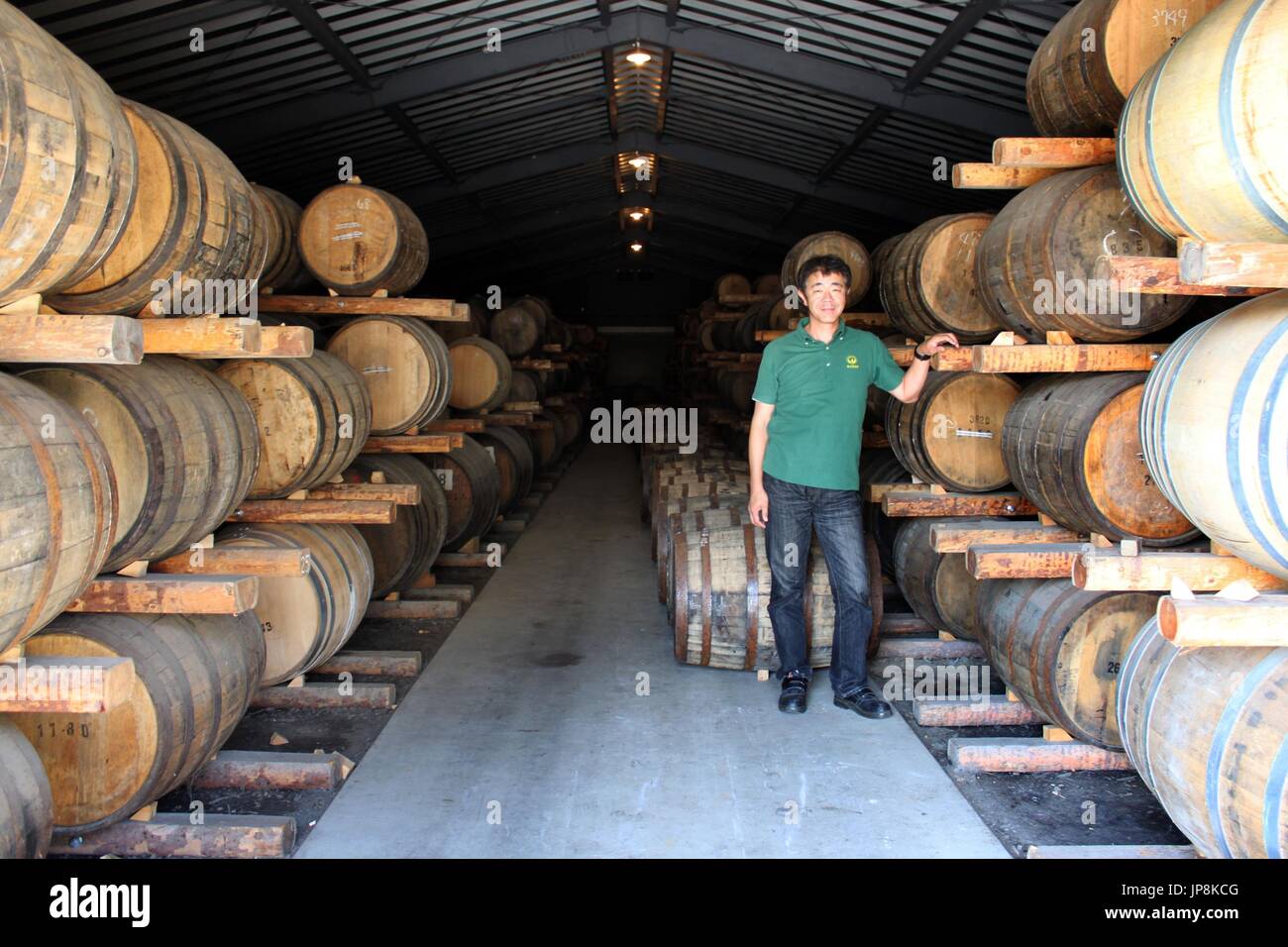 Venture Whisky Ltd. owner Ichiro Akuto shows off the shelves of casks ...