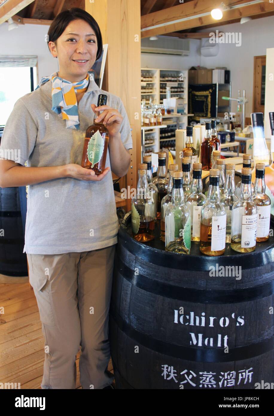 A staff member of Venture Whisky Ltd. shows a bottle of "Ichiro's Malt ...