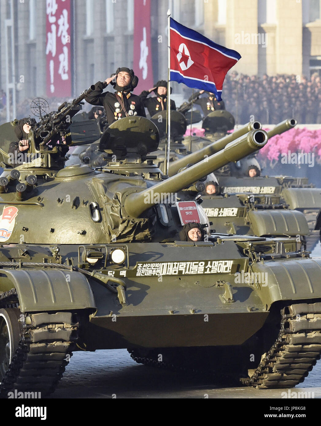 North Korean soldiers salute on tanks during a military parade in Kim ...