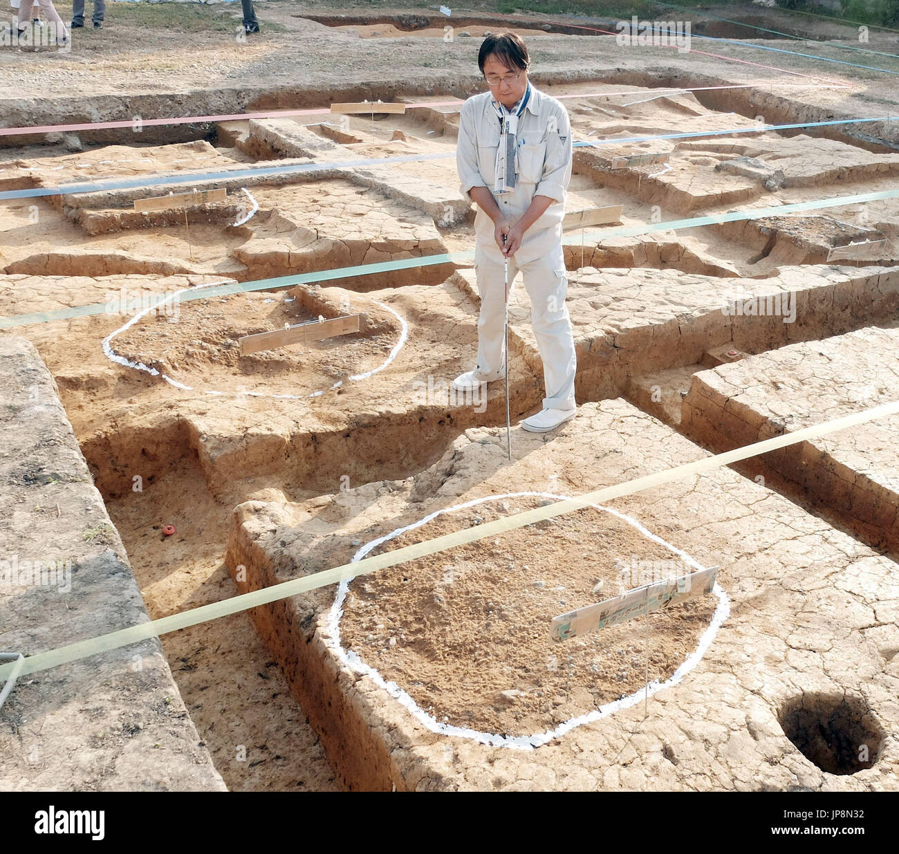 A representative of the Muko City Center for Archeological Operations ...