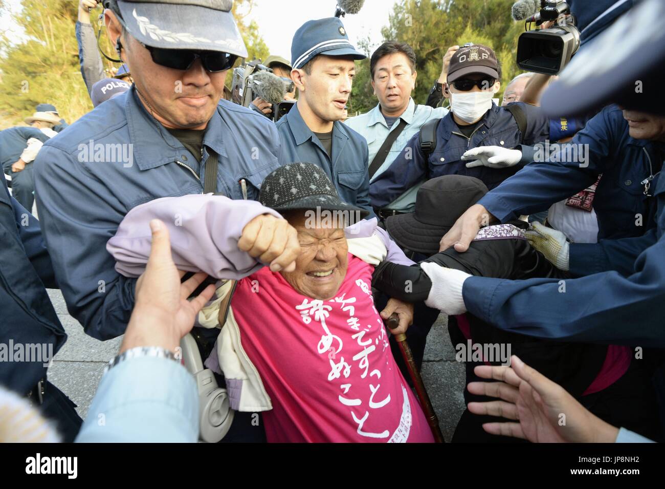 A man struggles with police officers at the front gate of the U.S ...