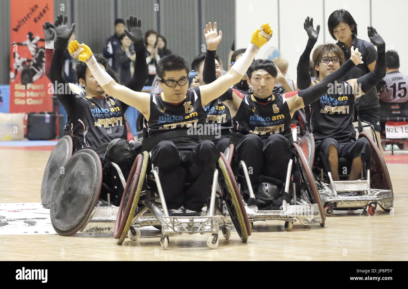 Members of Japan's men's wheelchair rugby team acknowledge the crowd ...