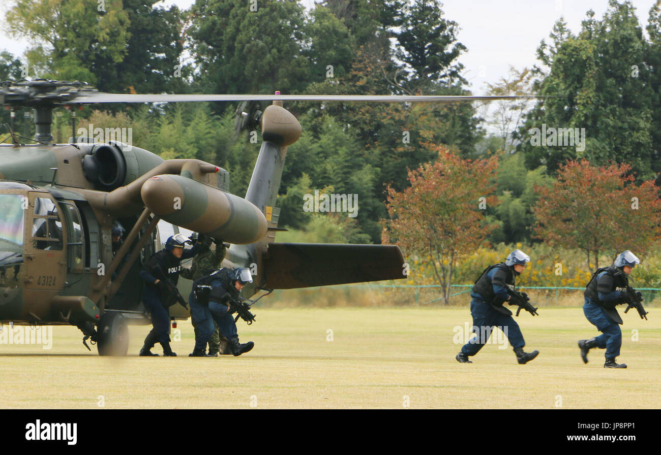 Members of a riot police squad get off a Japanese Ground Self-Defense ...