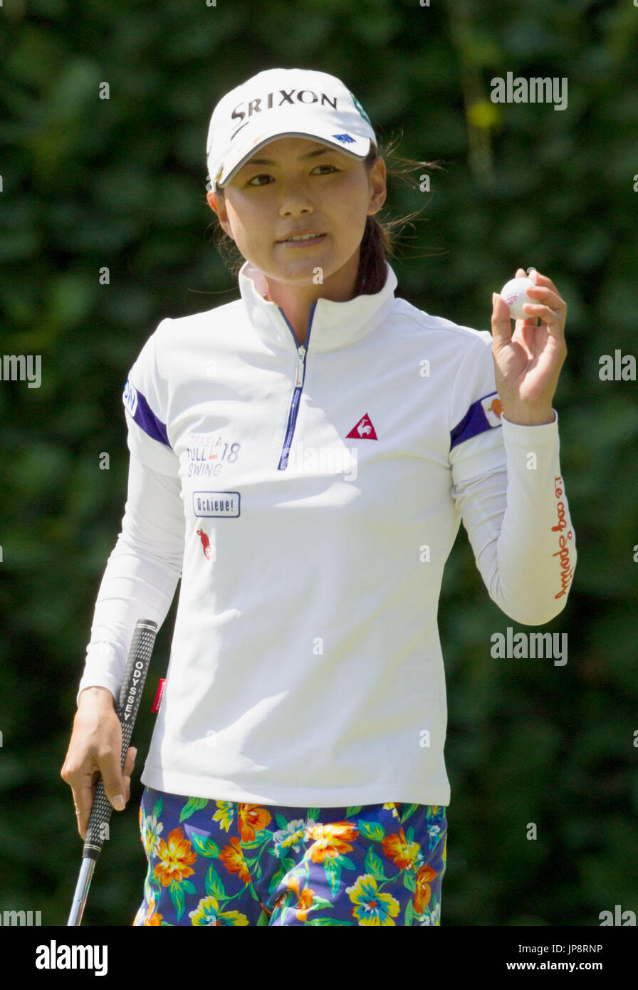 Japan's Sakura Yokomine acknowledges the gallery after sinking a birdie ...