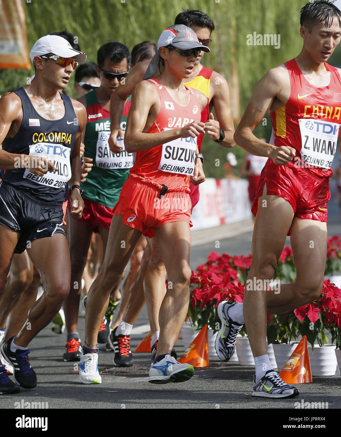 World record holder Yusuke Suzuki (C) of Japan competes in the men's 20 ...