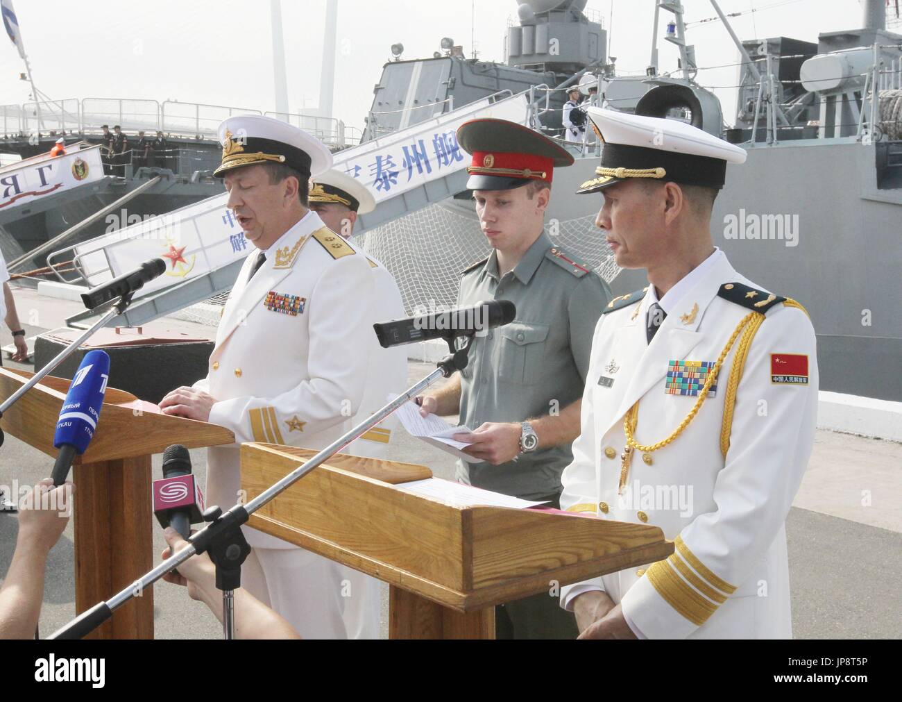 Senior Russian and Chinese naval officers attend a welcome ceremony in ...
