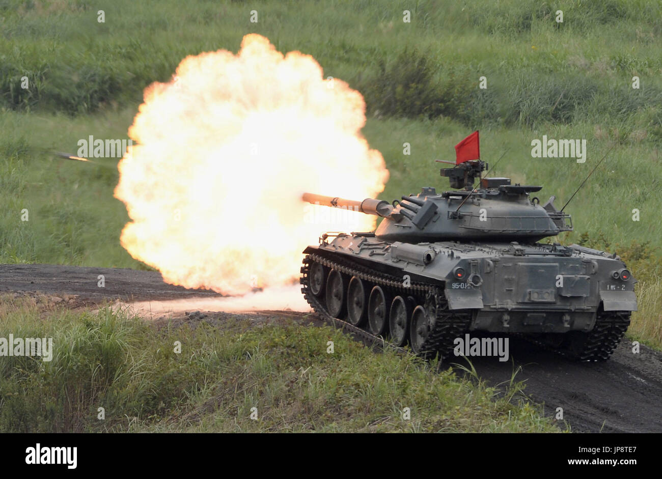 A Japan Ground Self-Defense Force Type 74 armored tank fires during an ...
