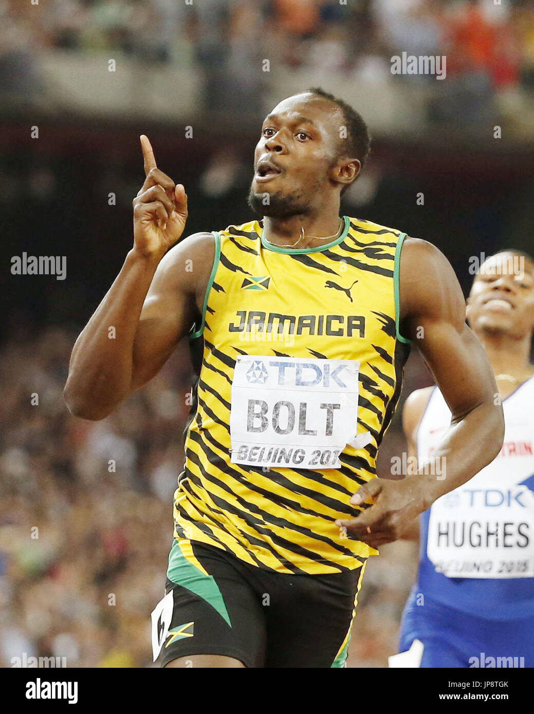Usain Bolt celebrates his victory in the 200-meter final at the world ...