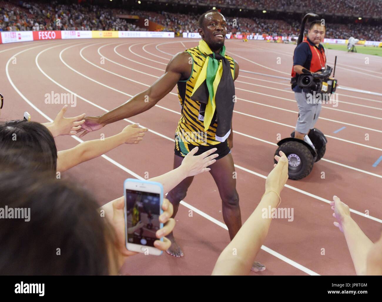 Usain Bolt celebrates his victory in the 200-meter final at the world ...