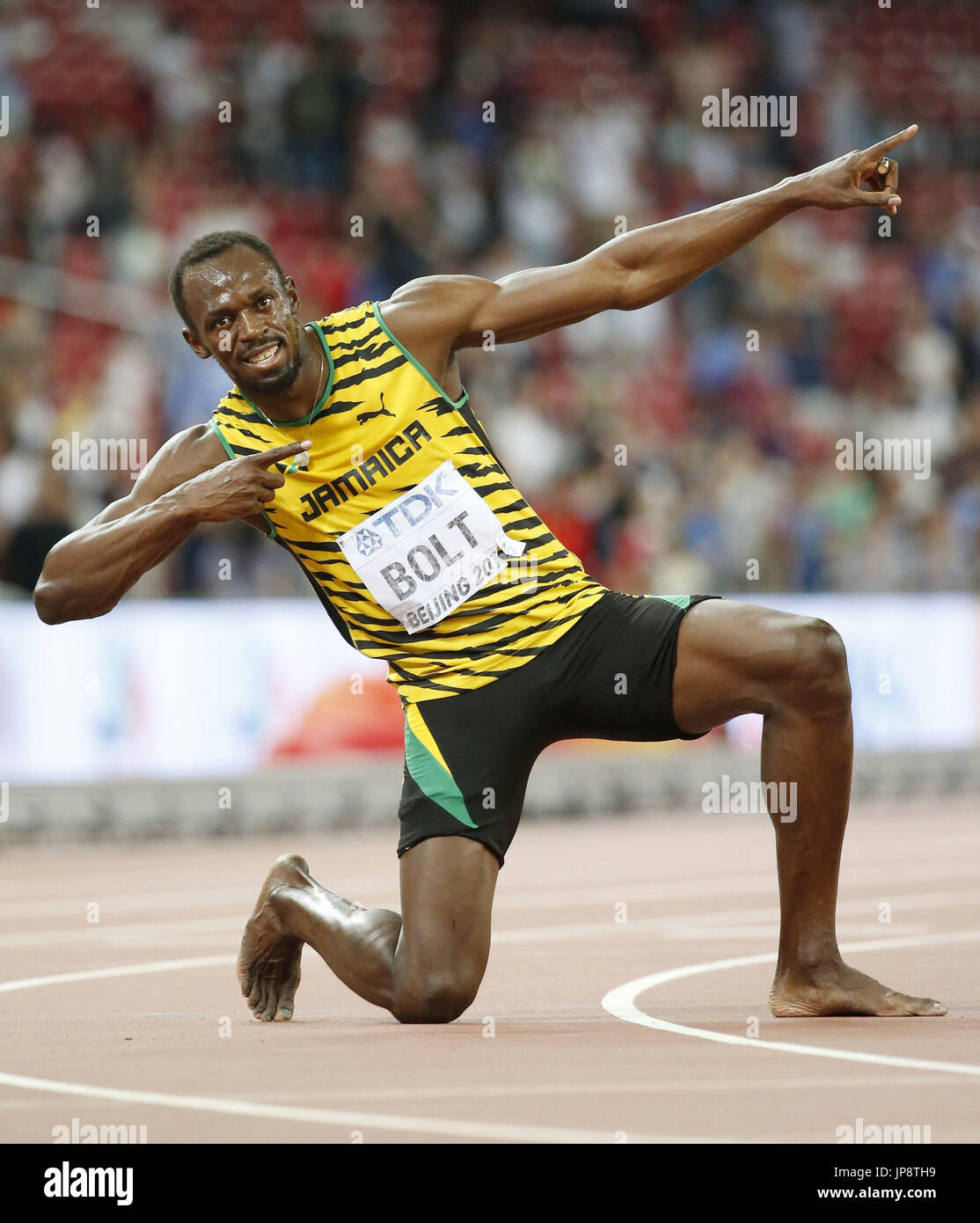 Jamaica's Usain Bolt strikes his signature lightning pose after winning ...