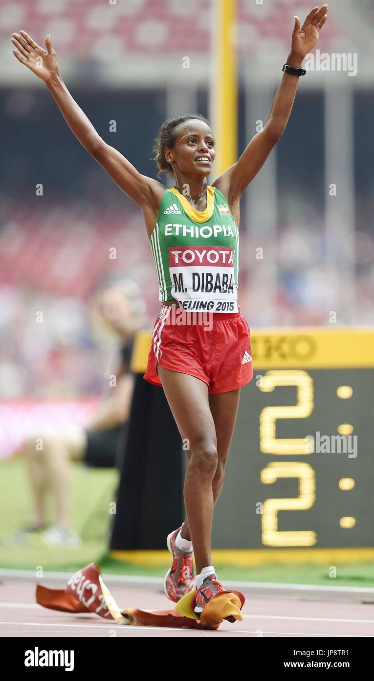 Mare Dibaba of Ethiopia acknowledge the crowd after winning the women's ...