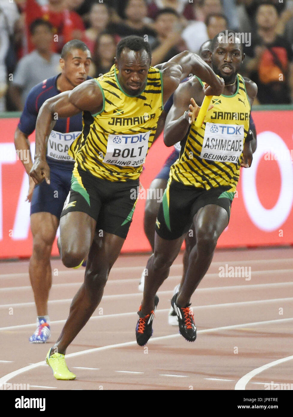 Usain Bolt (C), the anchor of the Jamaica's men's 4x100 meter relay ...