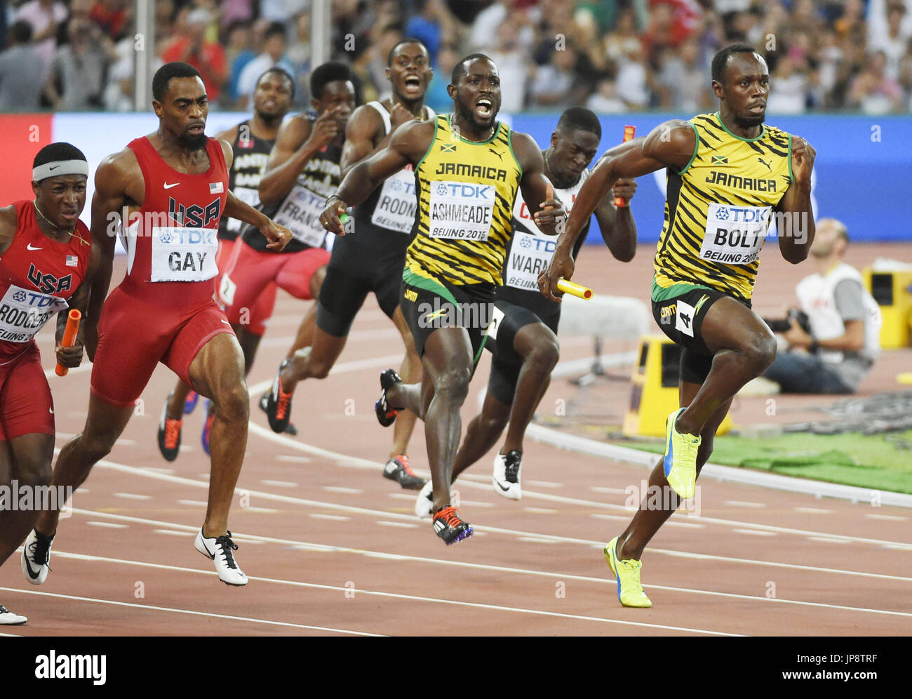 Usain Bolt (R), the anchor of the Jamaica's men's 4x100 meter relay ...