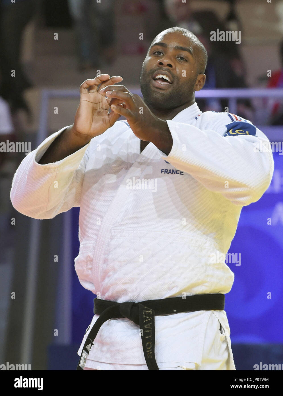 Teddy Riner of France expresses joy after winning the gold medal in the ...