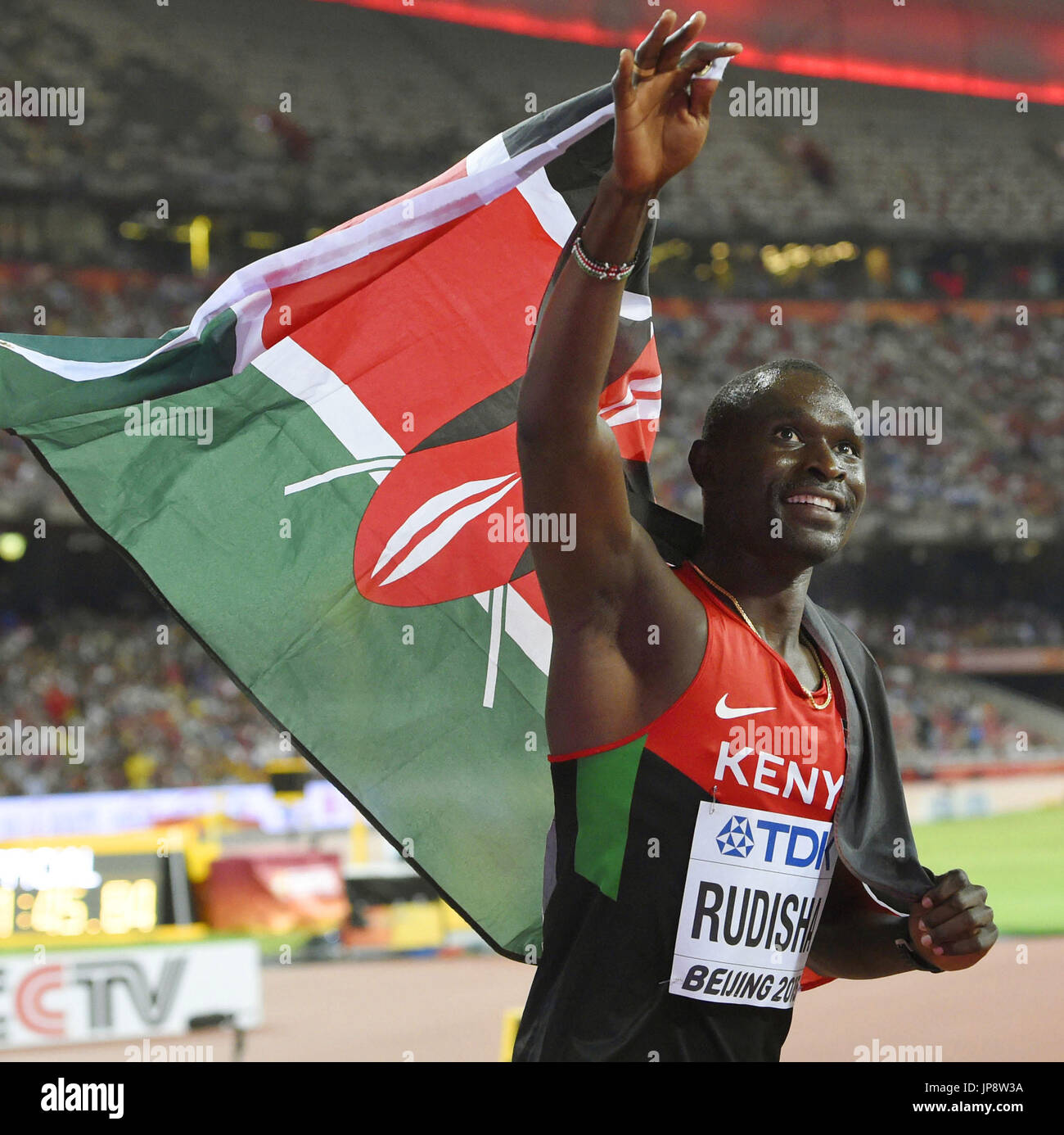 Kenya's David Rudisha waves his country's flag after winning the men's ...