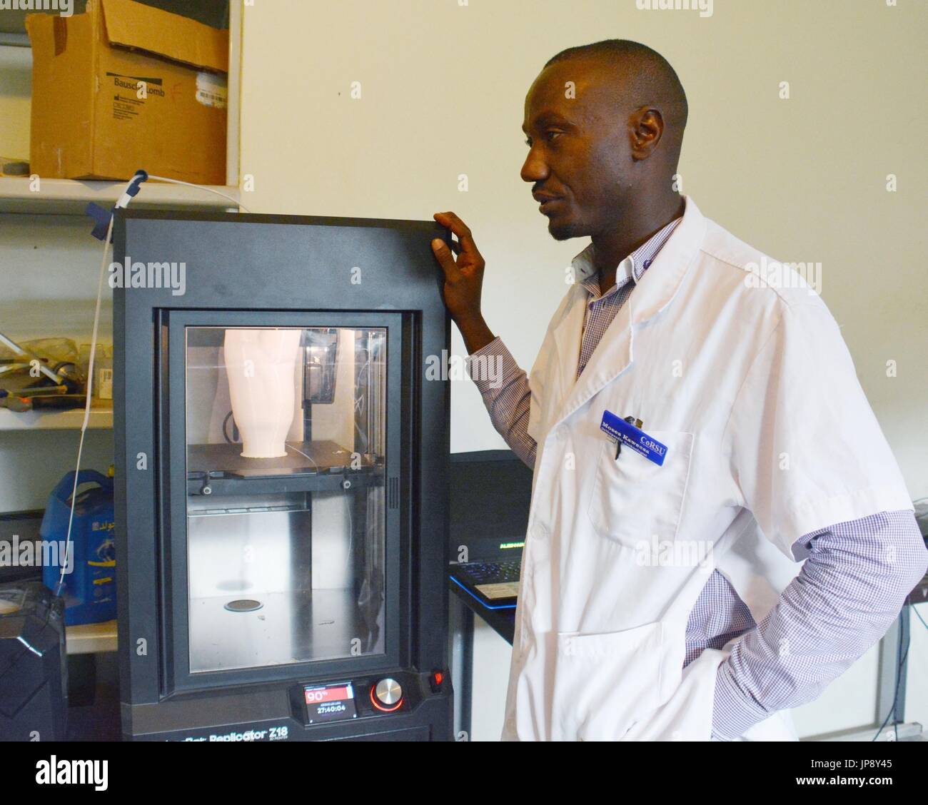 A staff member at a general hospital on the outskirts of Kampala, the ...