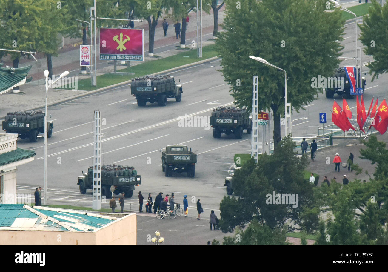 Military vehicles are seen carrying people in the direction of Kim Il ...