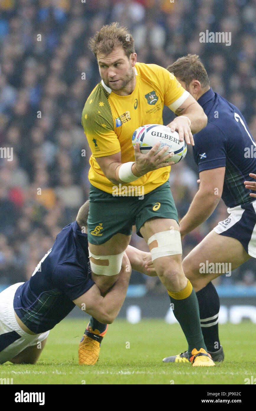 Australia's Ben McCalman (C) is tackled during the first half of his ...