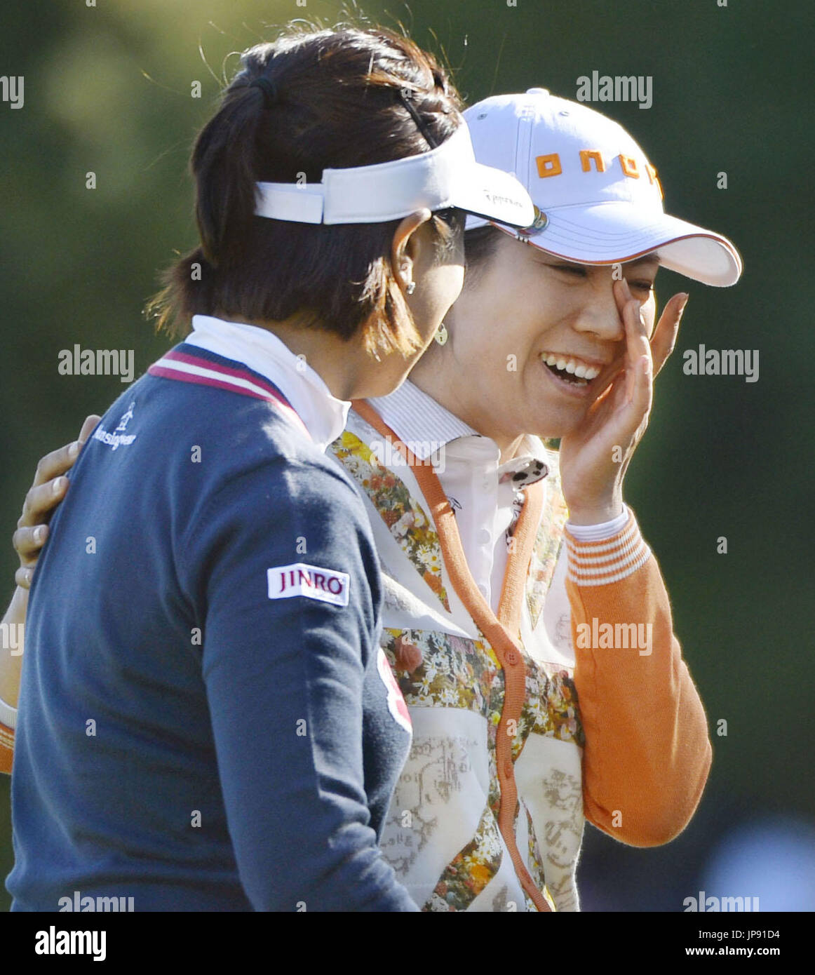 Lee Ji Hee of South Korea (back) is congratulated by her compatriot ...