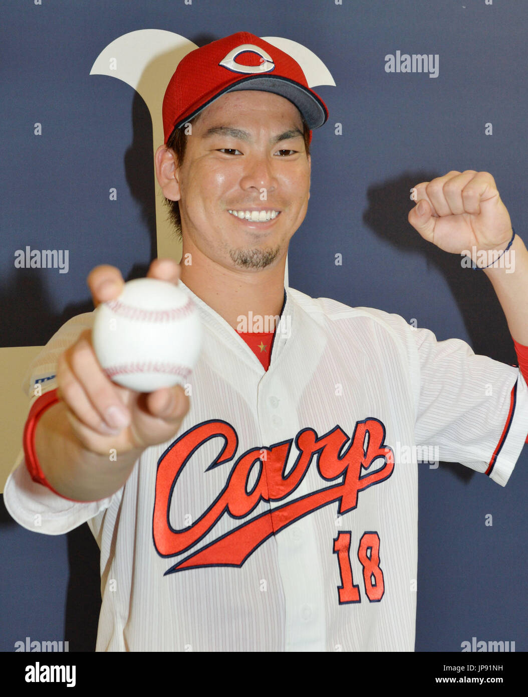 Hiroshima Carp ace Kenta Maeda poses for a photo during a press ...