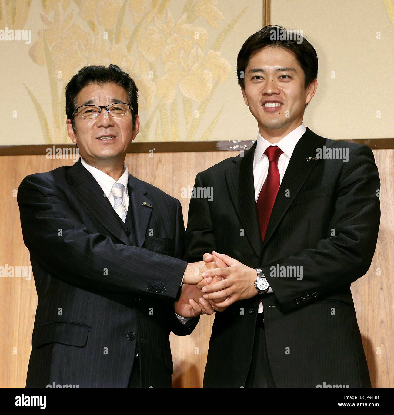 Osaka Gov. Ichiro Matsui (L) and Hirofumi Yoshimura, a former member of ...