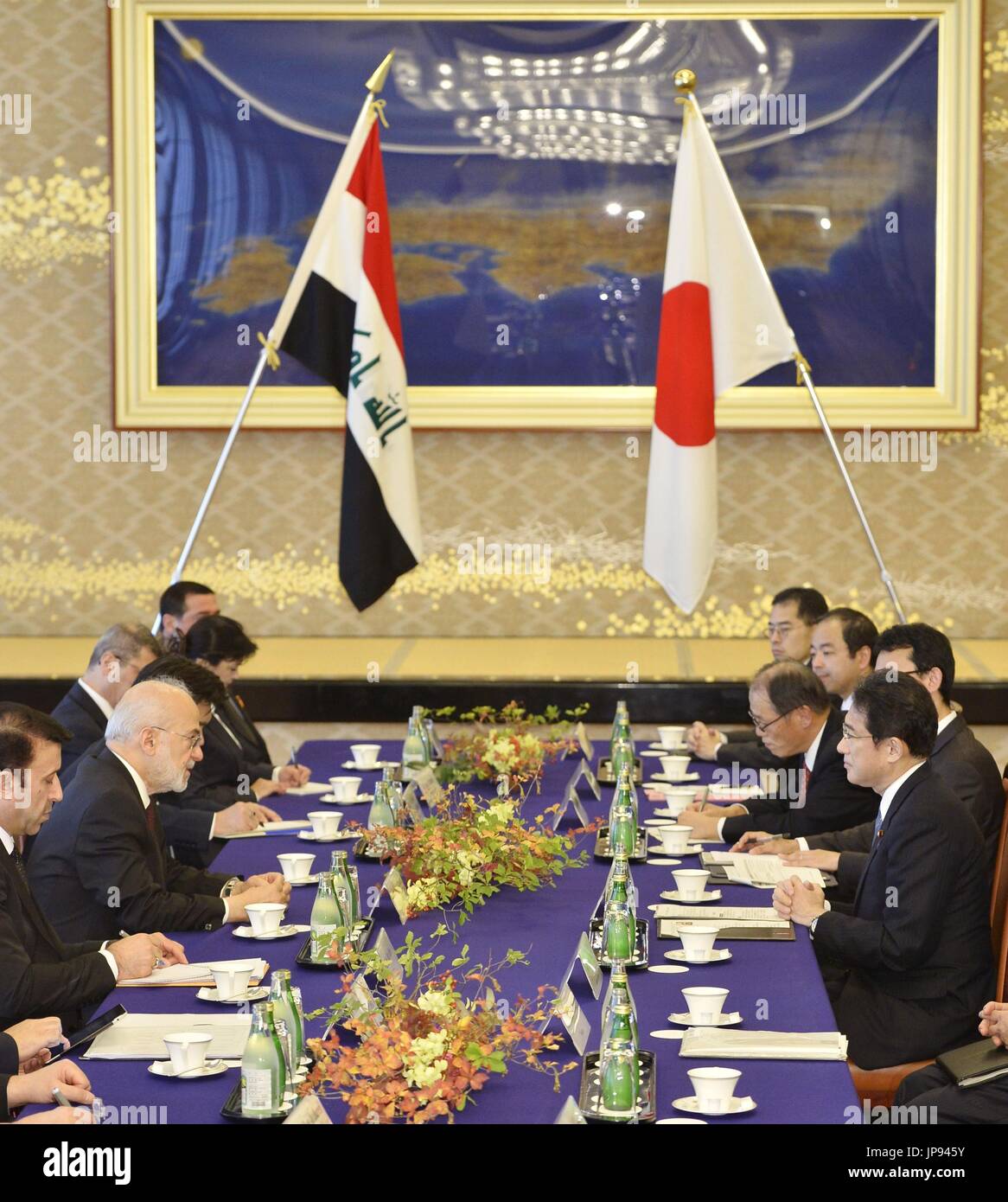 Japanese Foreign Minister Fumio Kishida (far R) talks with his Iraqi ...