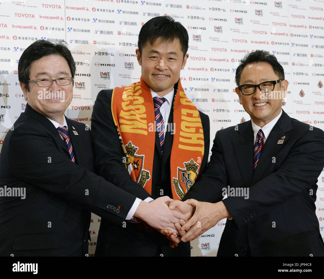 Takafumi Ogura (C), new coach and general manager of J-League soccer ...