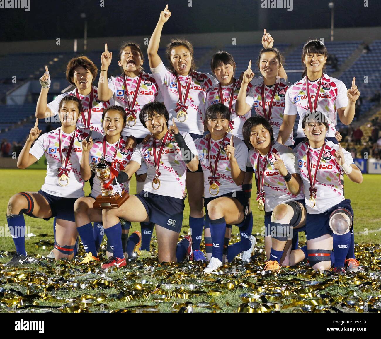 Japanese women's sevens rugby players pose for a photo after beating ...
