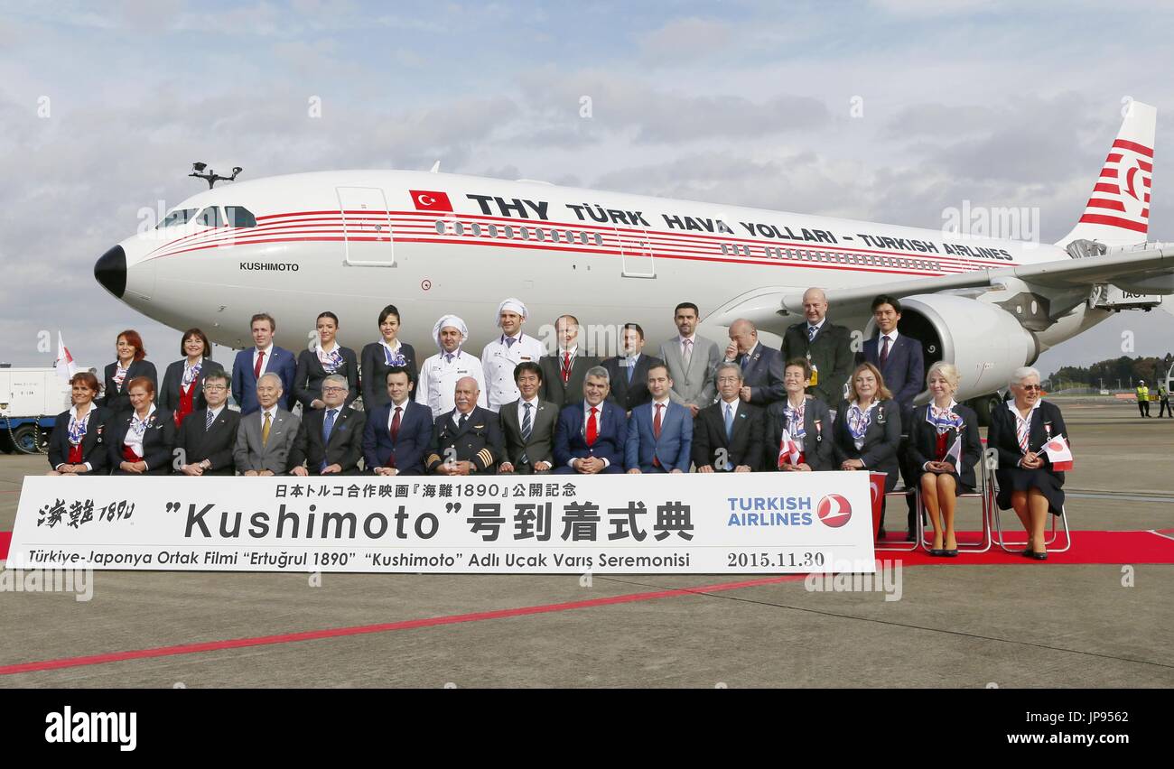 Japanese and Turkish people pose for a photo in front of a special ...