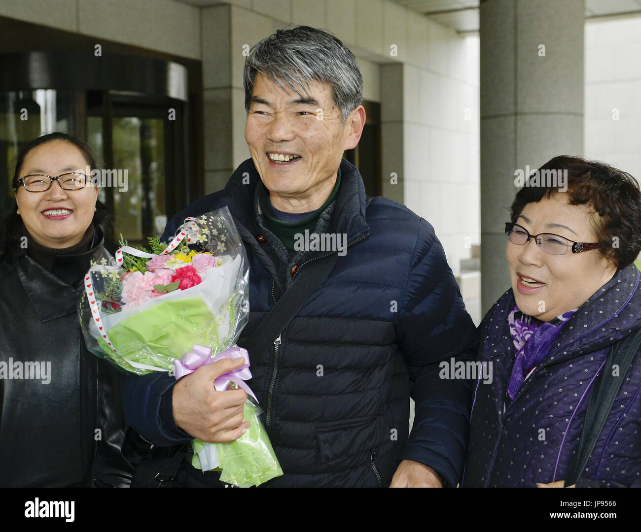 Lee Chul (C) smiles after South Korea's Supreme Court finalized his ...