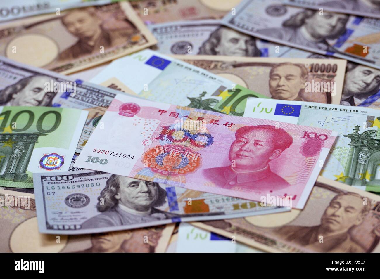 Photo taken Nov. 30, 2015, shows Chinese 100 yuan bills, 100 euro bills ...