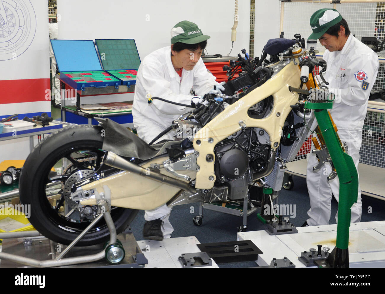 Honda Motor Co. engineers assemble the RC213V-S, a street version of ...