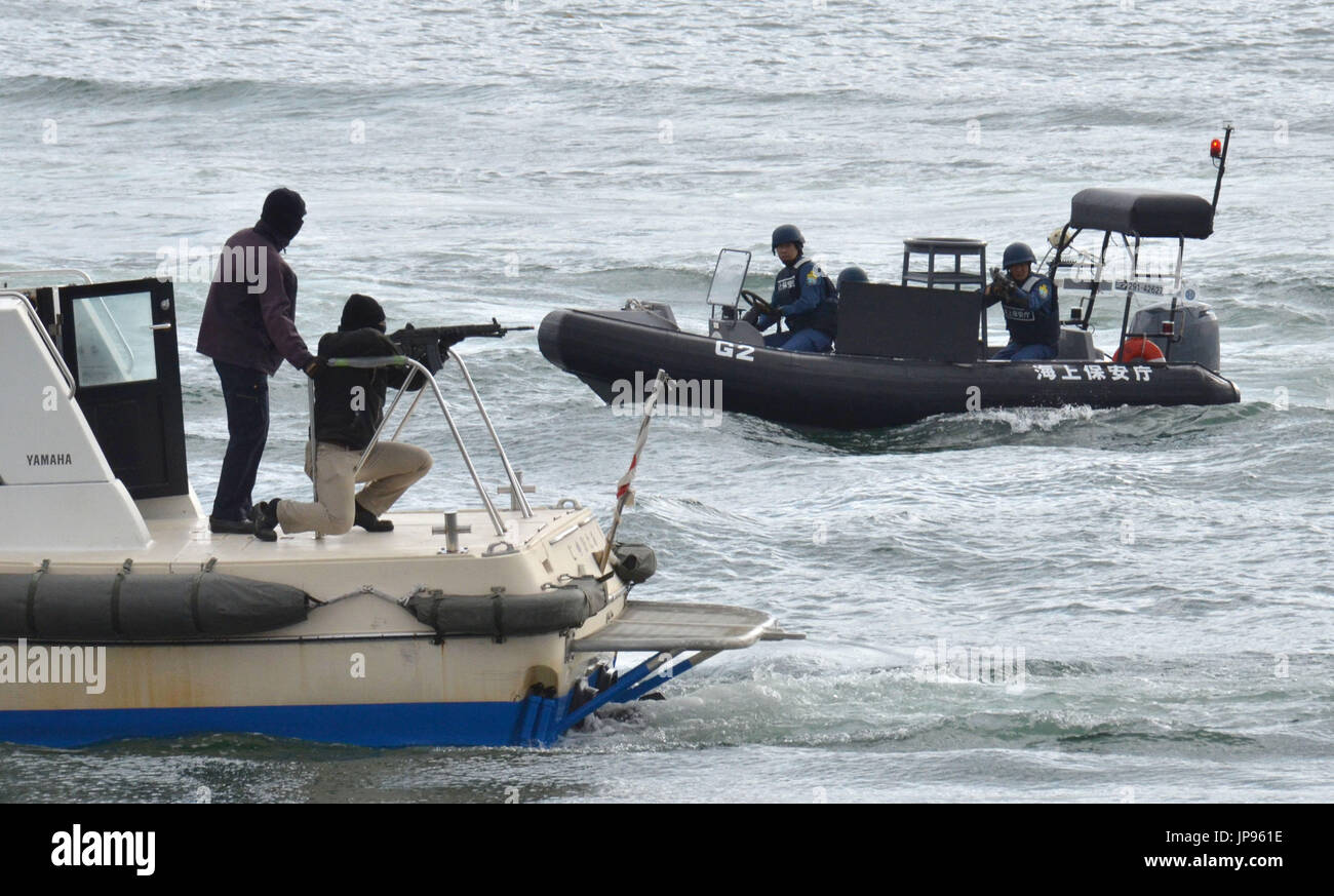 Coast guard personnel take part in a drill simulating a maritime terror ...
