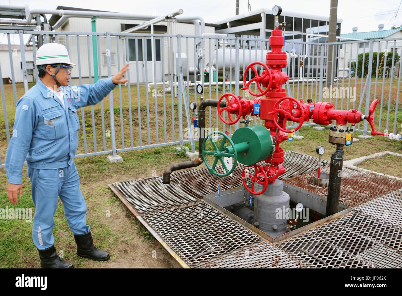 A man points to a valve used to send natural gas into the exhausted ...