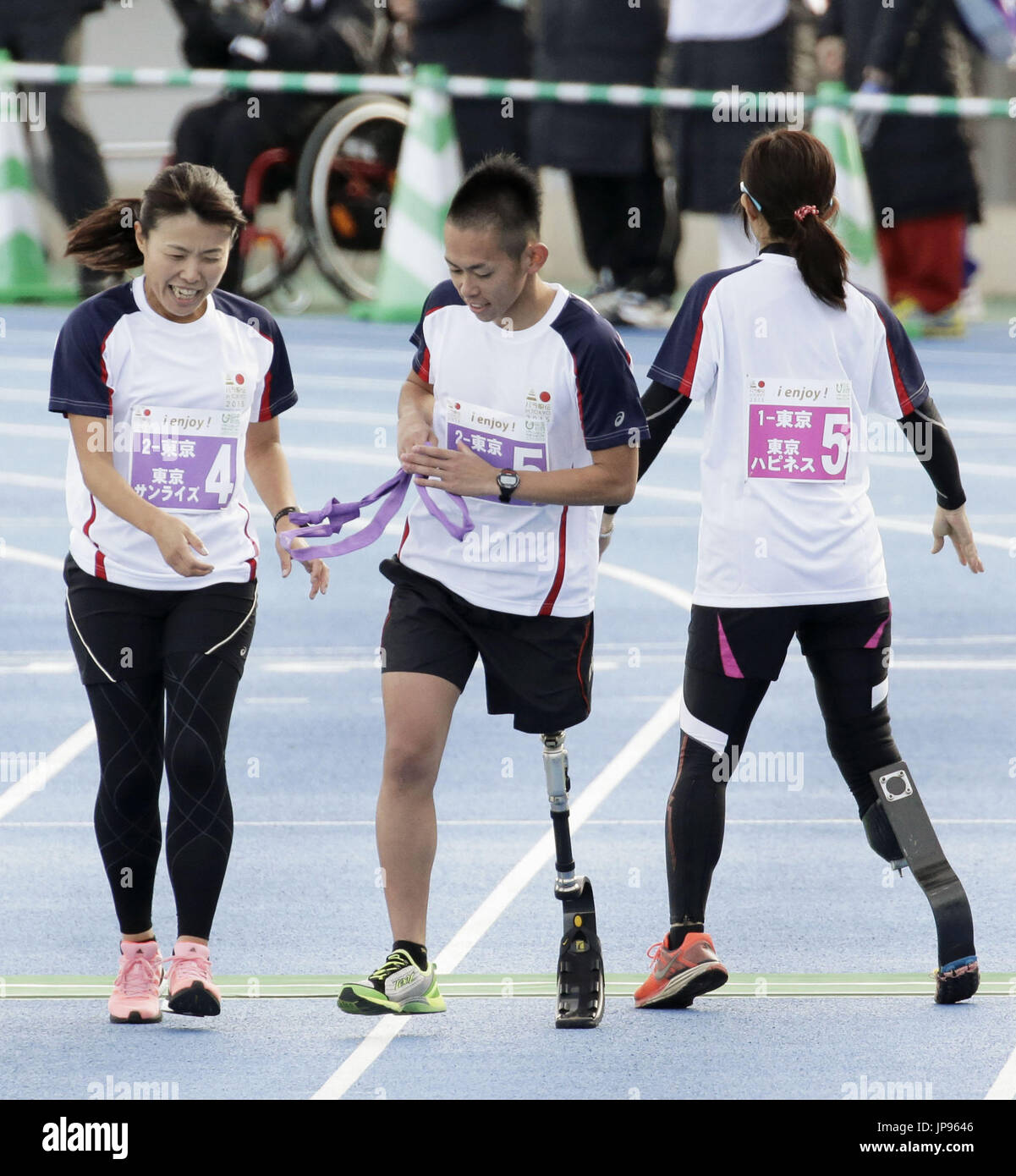 Runners with and without disabilities take part in an "ekiden" relay ...